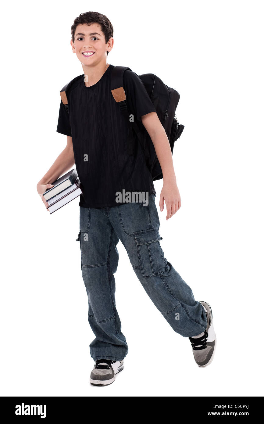 Handsome teenager boy student with books in hand on isolated white ...