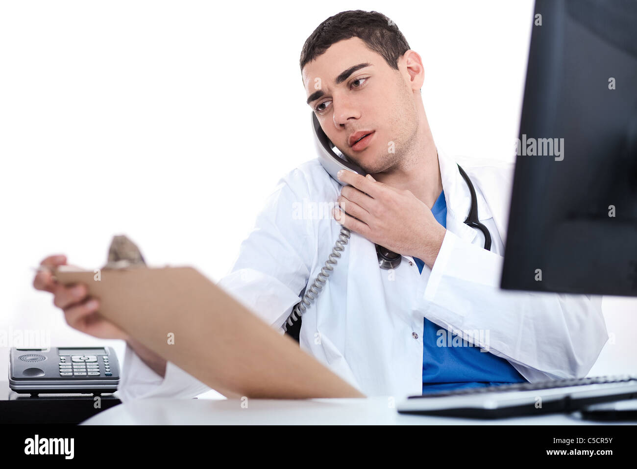 Doctor convey his notes to others over phone Stock Photo - Alamy
