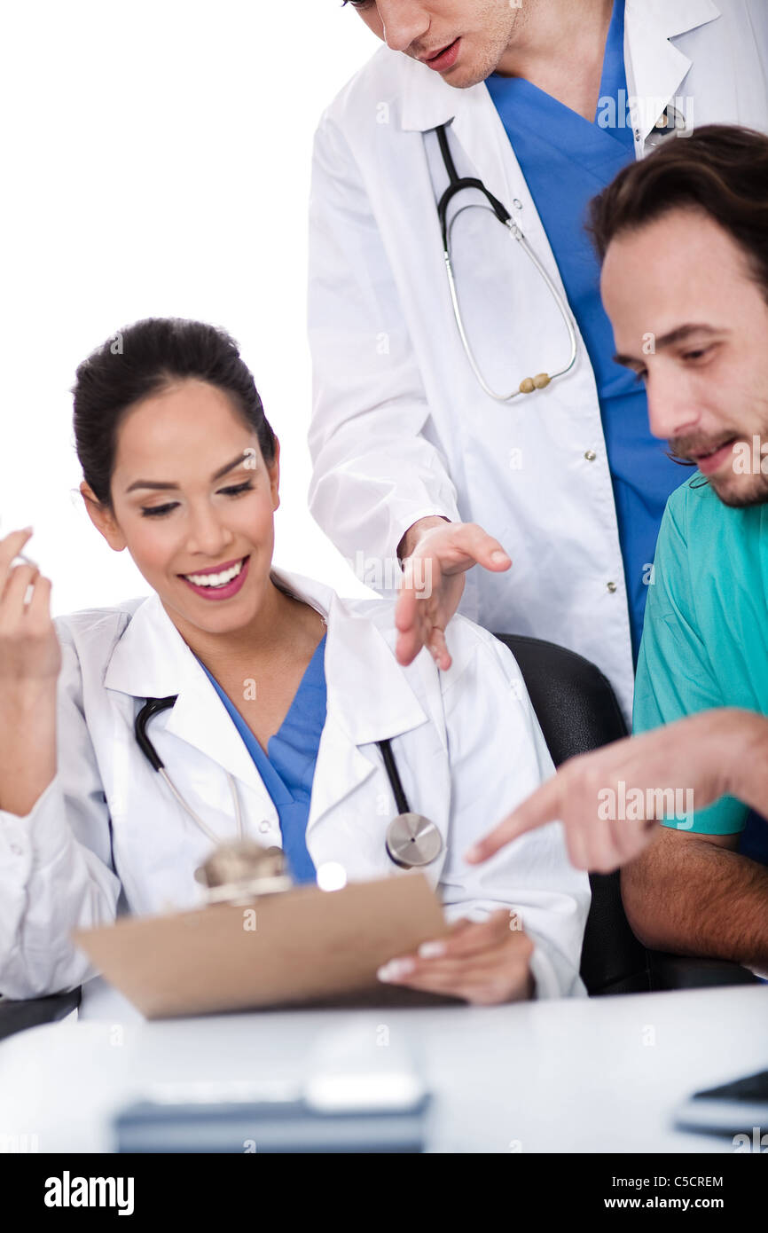 Group of doctors working together over white background Stock Photo - Alamy