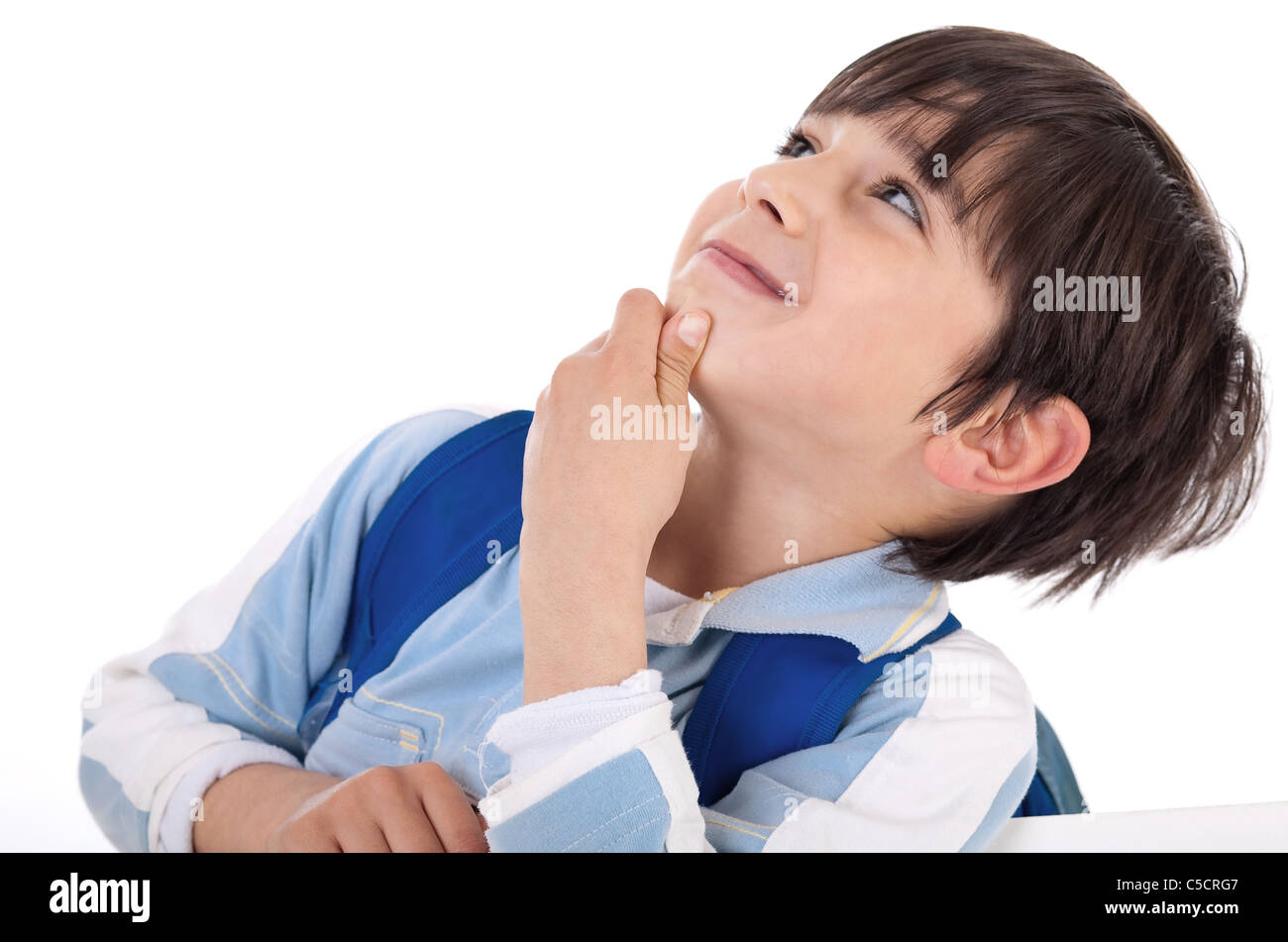 Cute kid thinking and looking up on isolated white background Stock ...