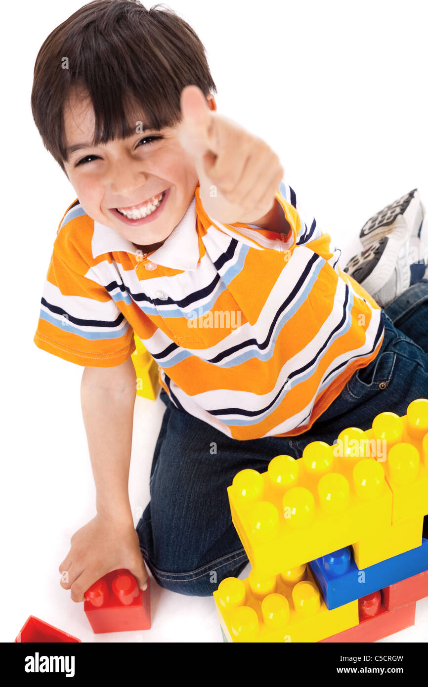 Boy shows ok sign when playing over white background Stock Photo - Alamy