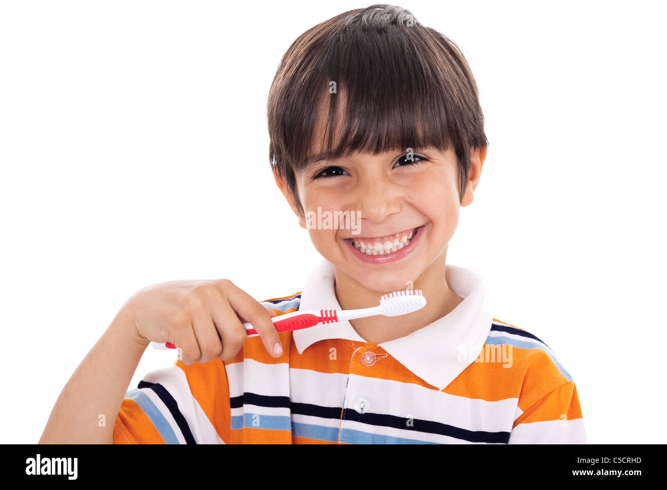 Closeup of cute kid brushing his teeth on isolated white background ...
