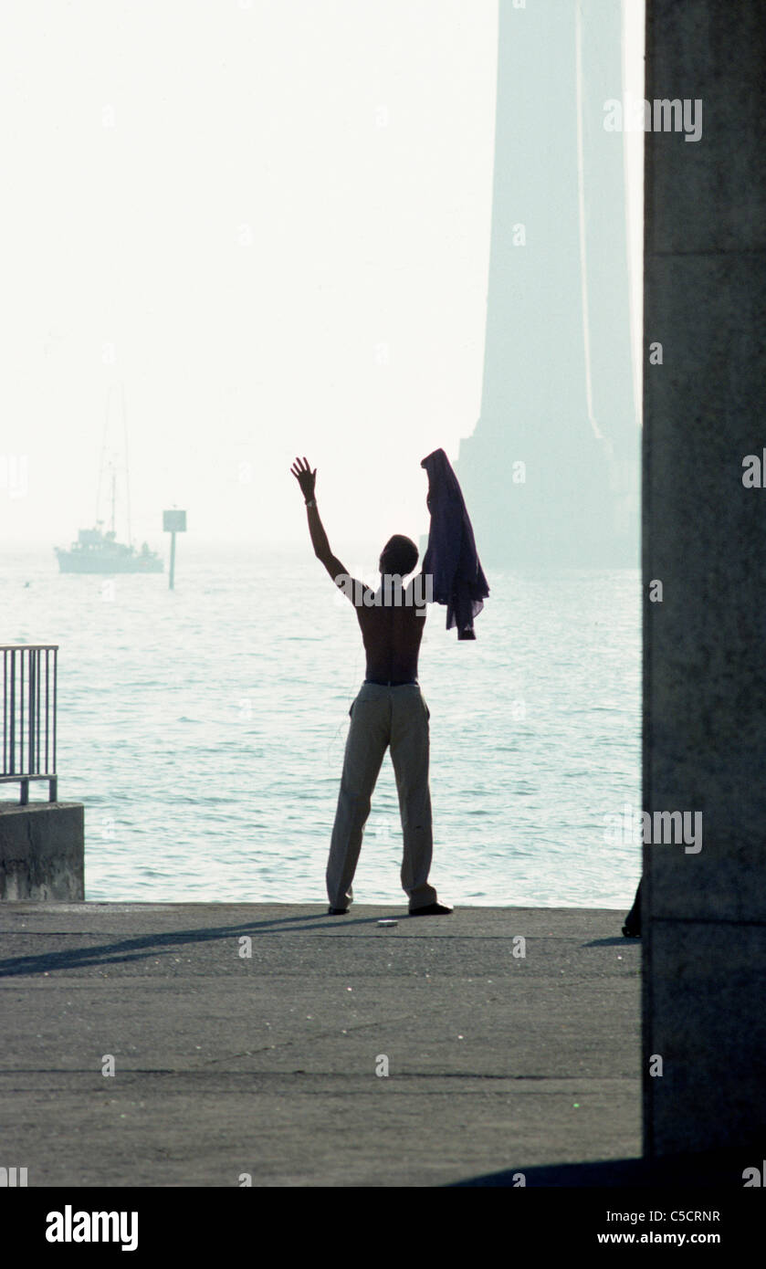 San Francisco, California. Black man wearing walk man greets the ...