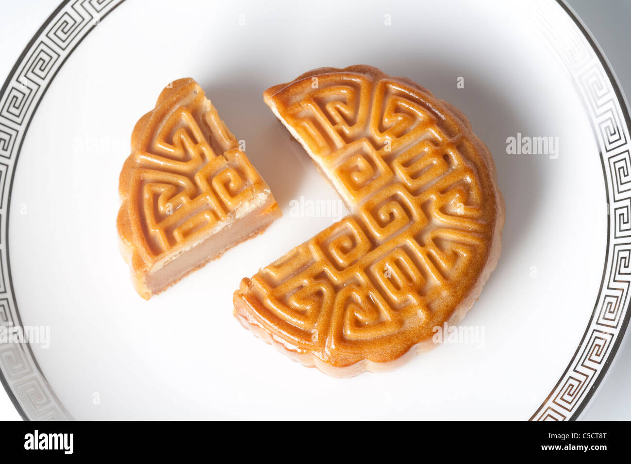 Mid-Autumn Festival Moon Cake, Cut and Presented on Plate Stock Photo ...