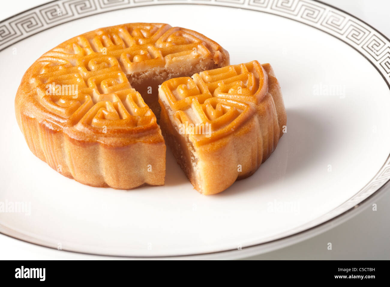 Mid-Autumn Festival Moon Cake, Cut and Presented on Plate Stock Photo ...