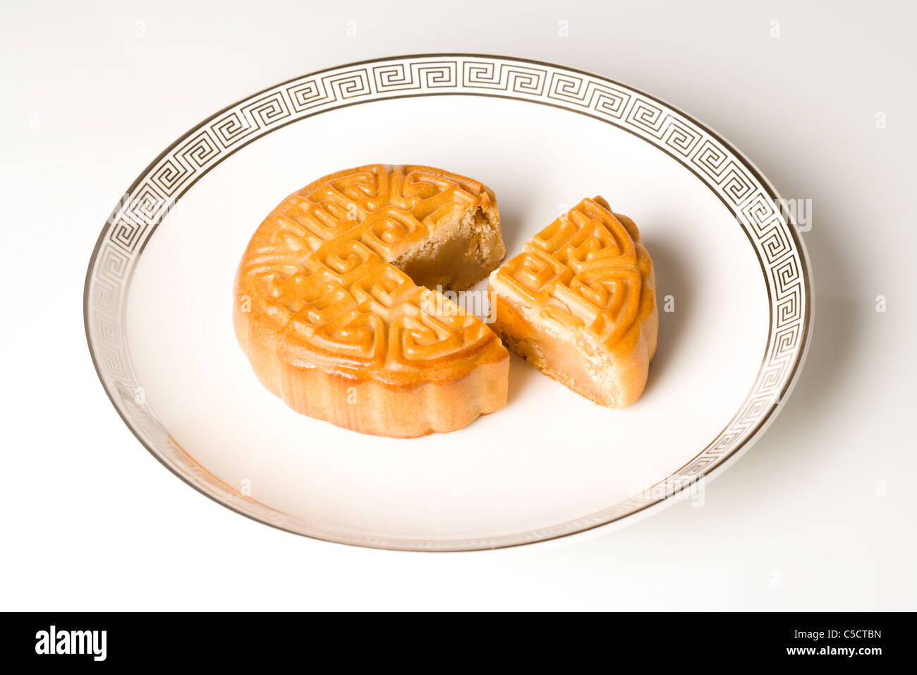 Mid-Autumn Festival Moon Cake, Cut and Presented on Plate Stock Photo ...
