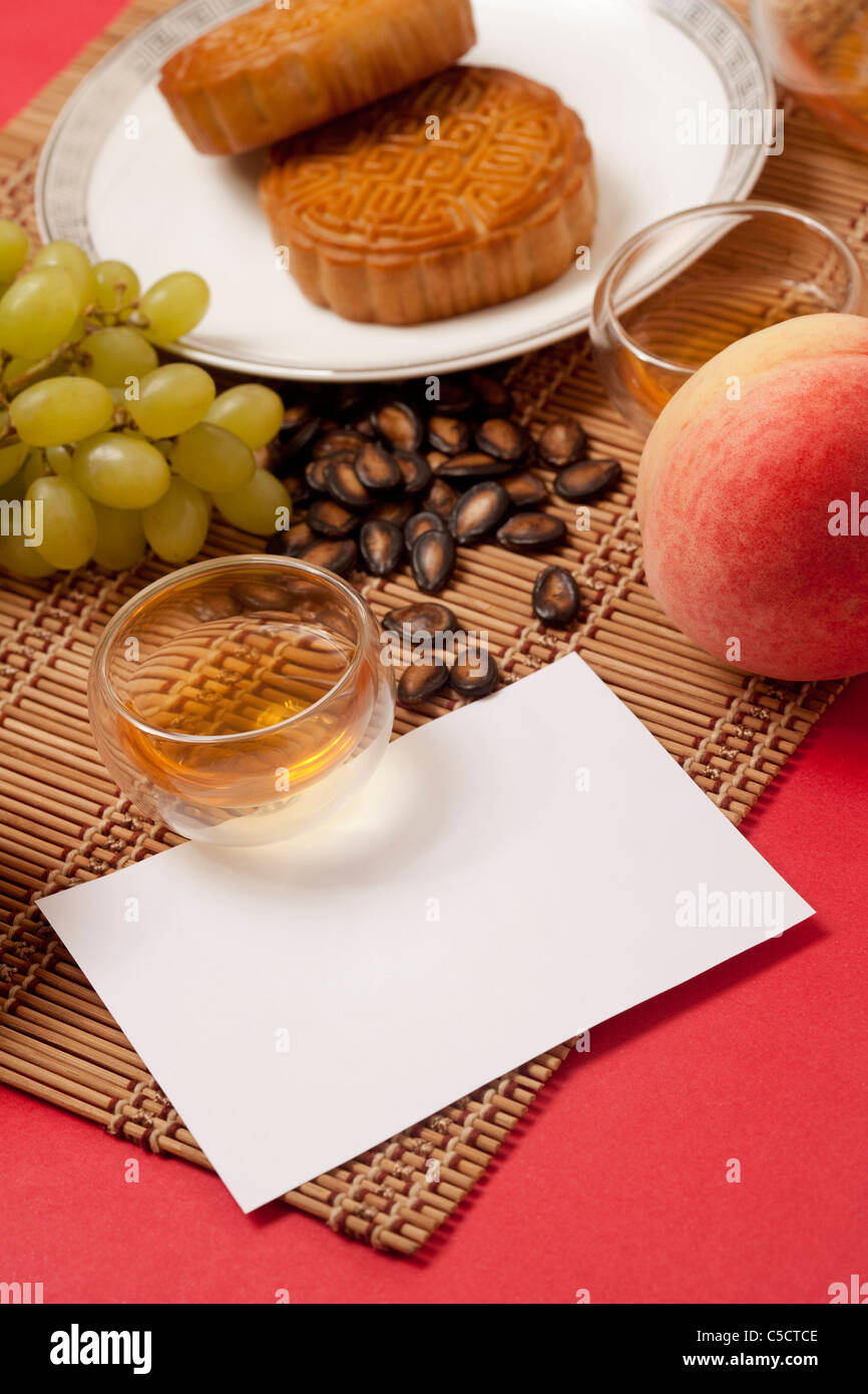 Moon Cakes with Fresh Fruit, Seeds, and Tea Stock Photo - Alamy