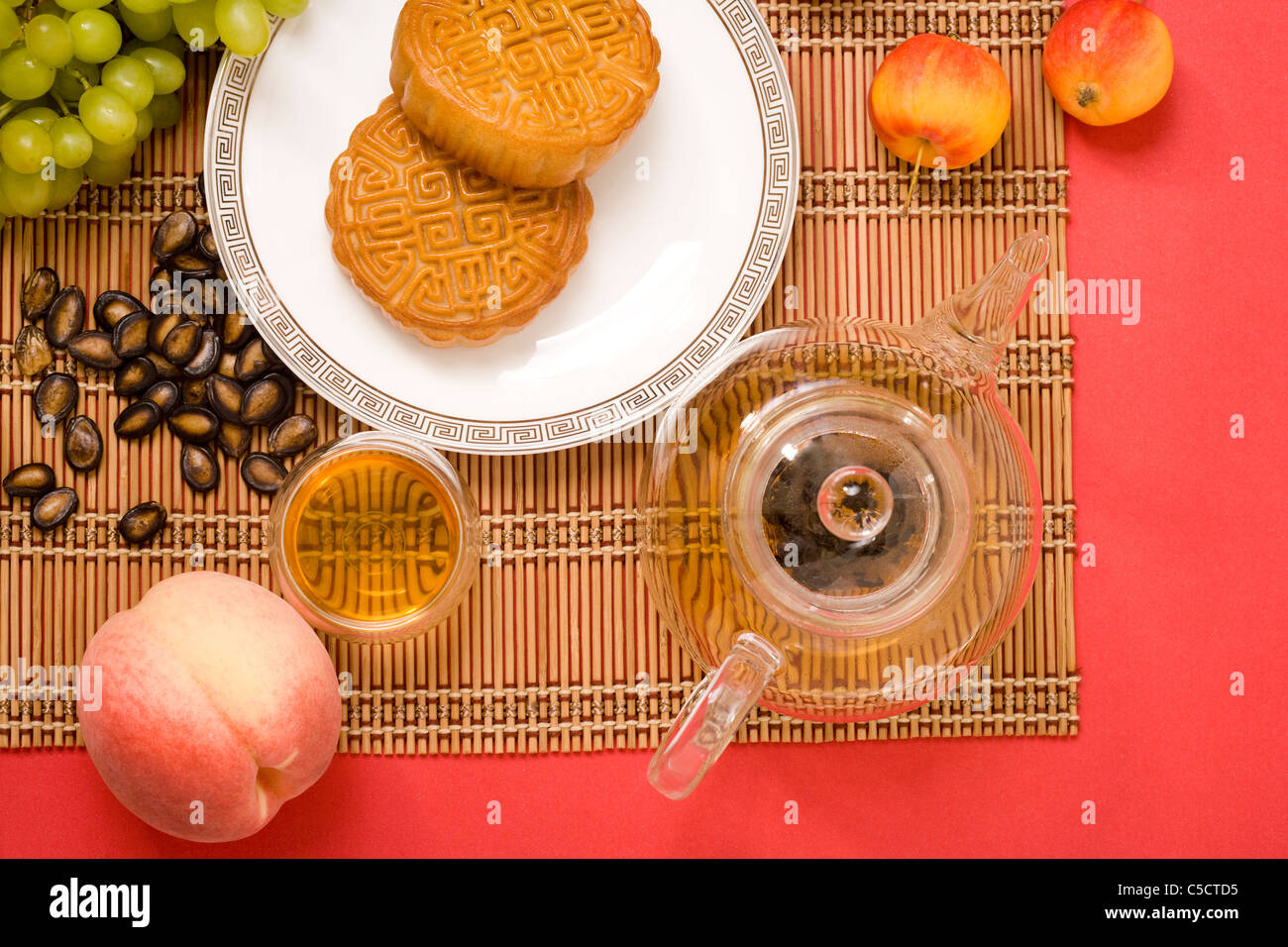 Moon Cakes with Fresh Fruit, Seeds, and Tea Stock Photo - Alamy
