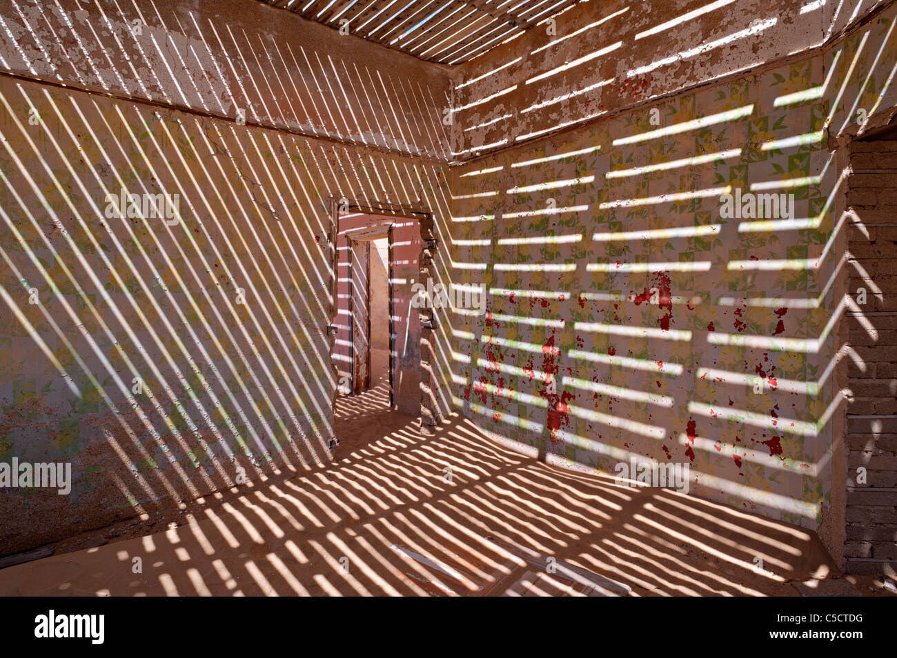 Sun shadows in building without roof, Kolmanskop Ghost Town near ...