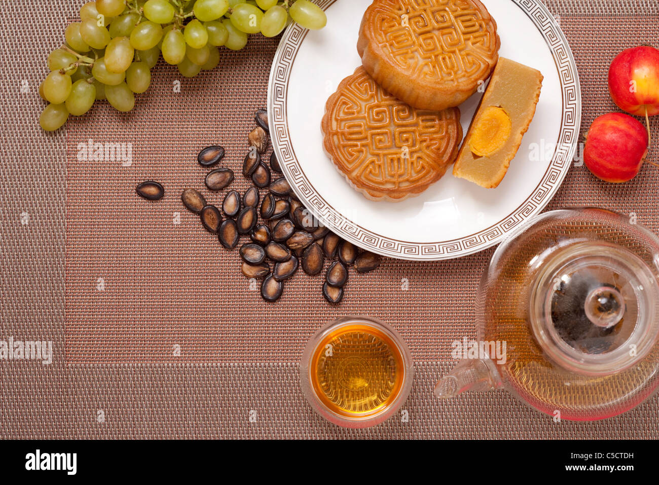 Moon Cakes with Fresh Fruit, Seeds, and Tea Stock Photo - Alamy