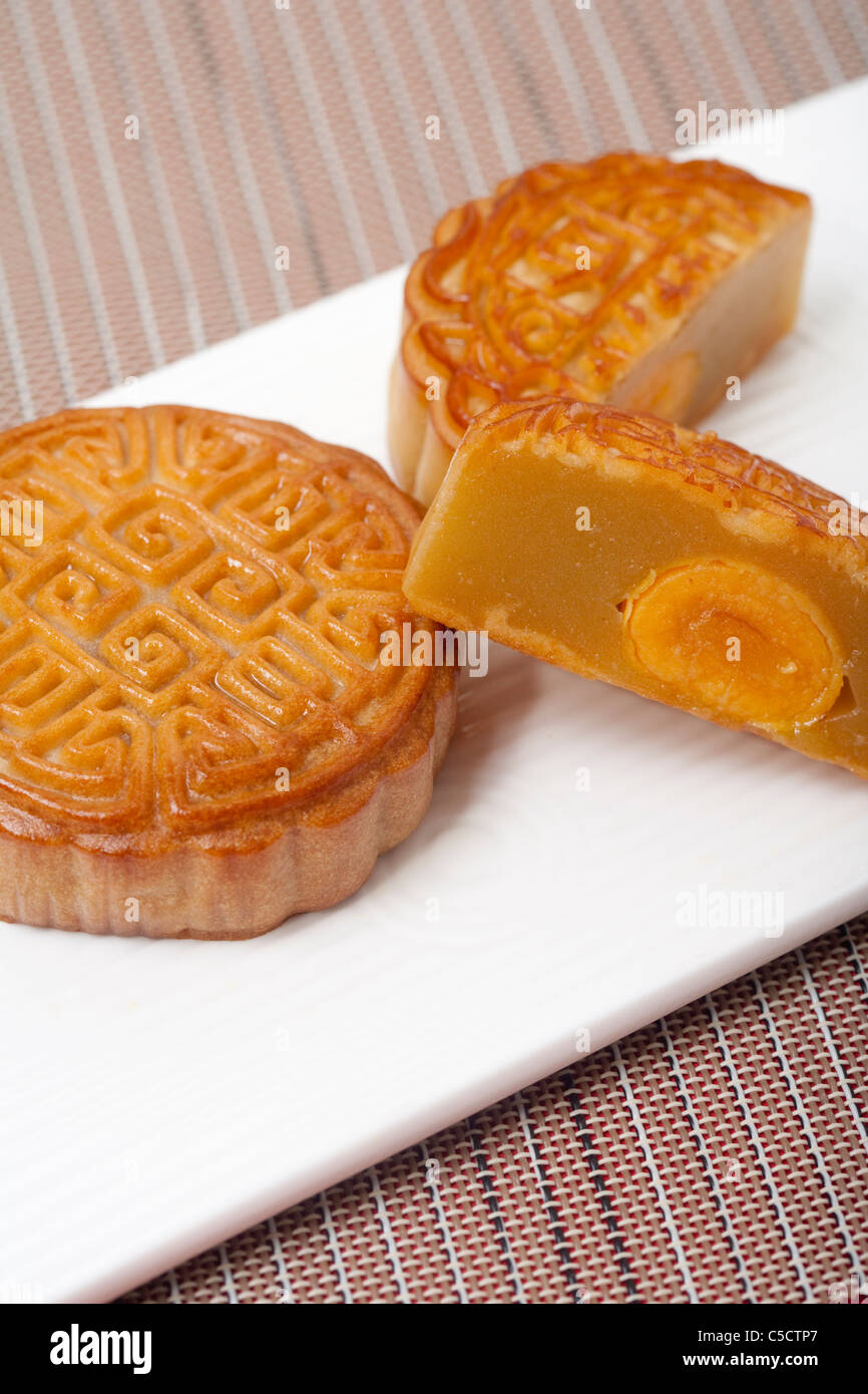 Cut Moon Cake on a Modern Rectangular Plate Stock Photo - Alamy