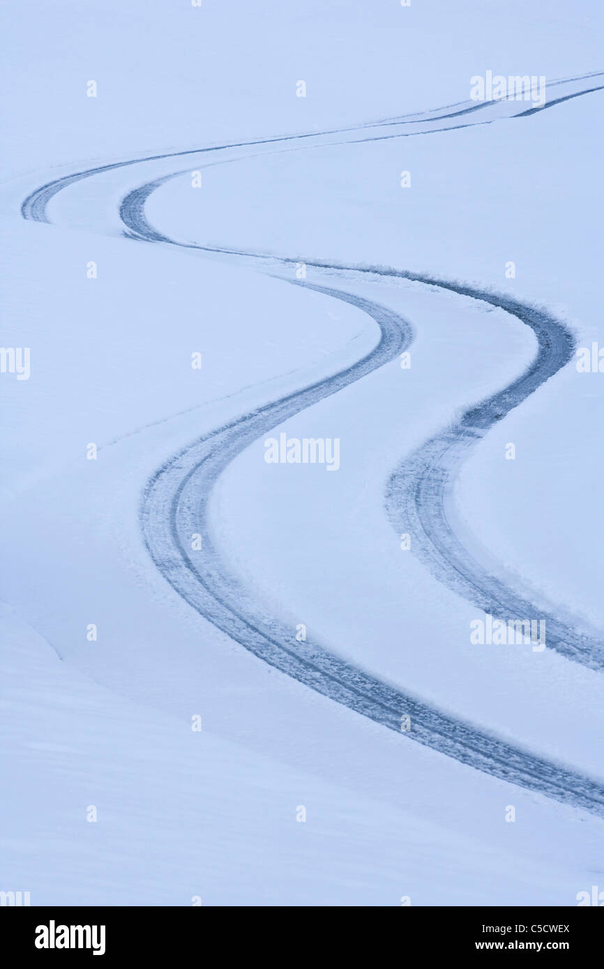 wheel tracks on snowy road Stock Photo - Alamy