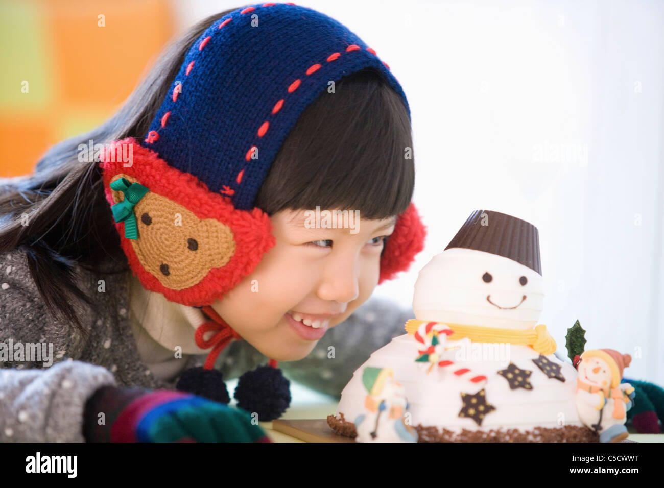 girl look at cake in details Stock Photo - Alamy
