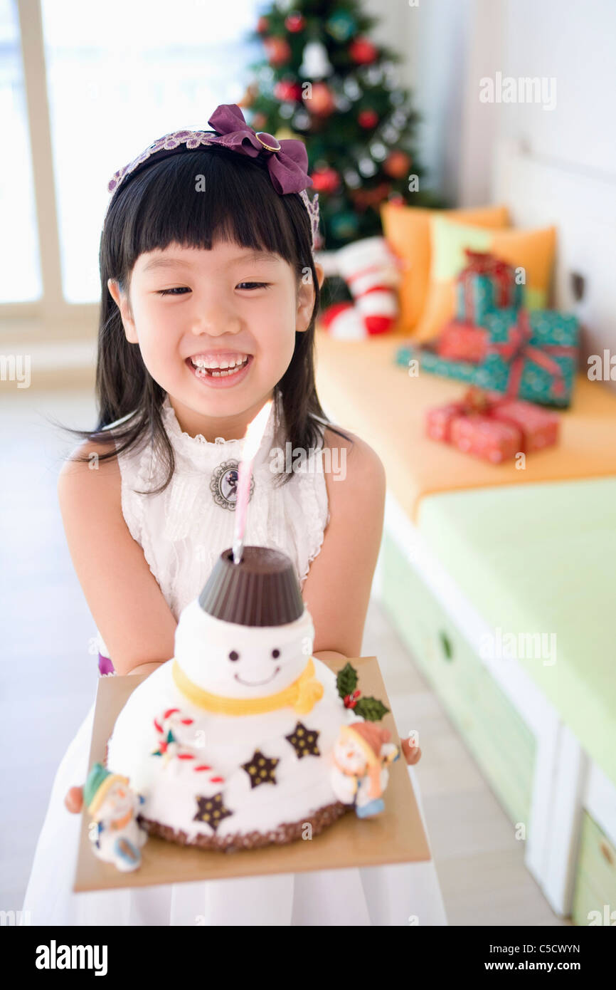 girl got present wearing white dress Stock Photo - Alamy