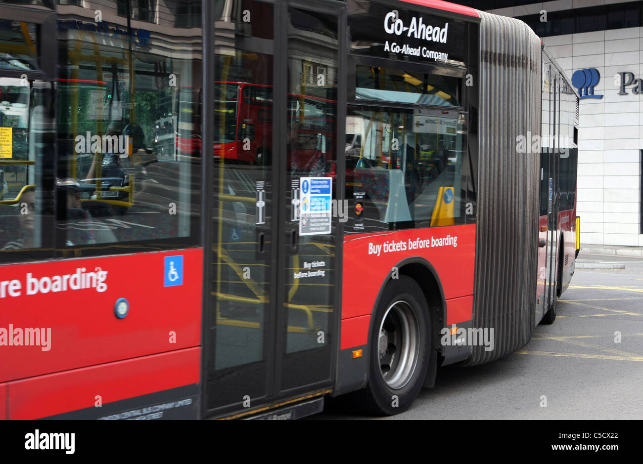 A bendy bus traveling around Westminster in London Stock Photo - Alamy