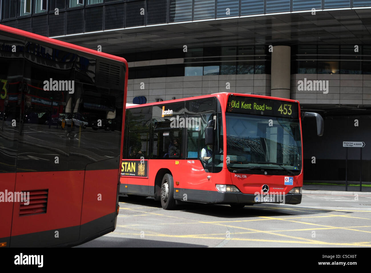 Parts of two bendy buses traveling in Westminster, London Stock Photo ...