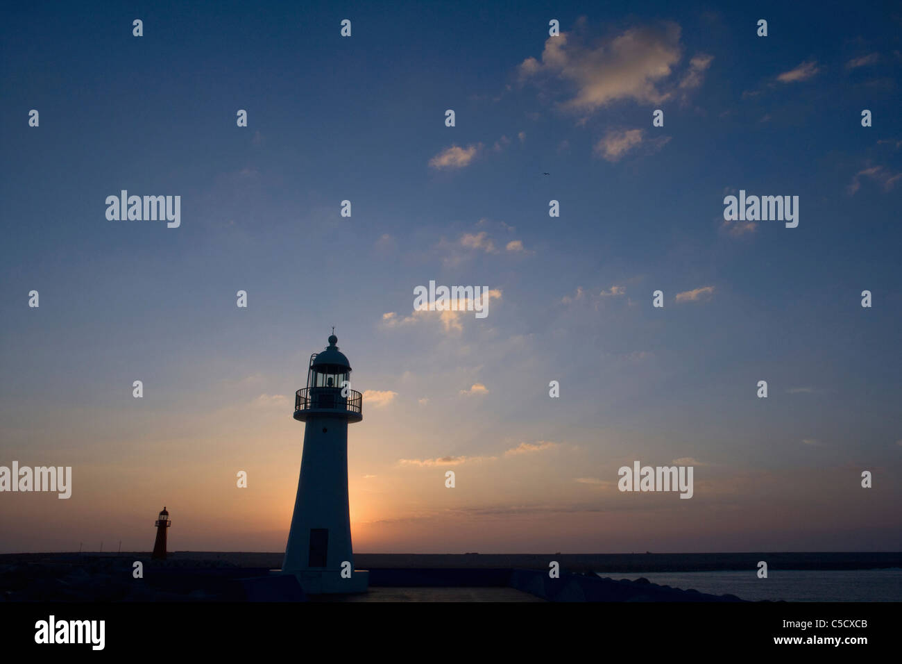 light house under the sunset glow Stock Photo - Alamy