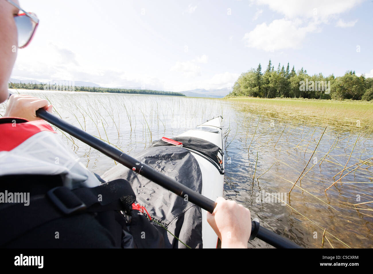 Cropped woman kayaking in the peaceful lake Stock Photo - Alamy