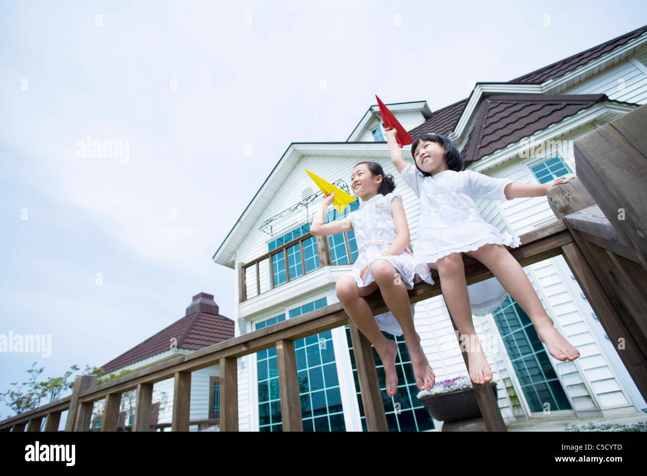 girls flying paper planes Stock Photo - Alamy