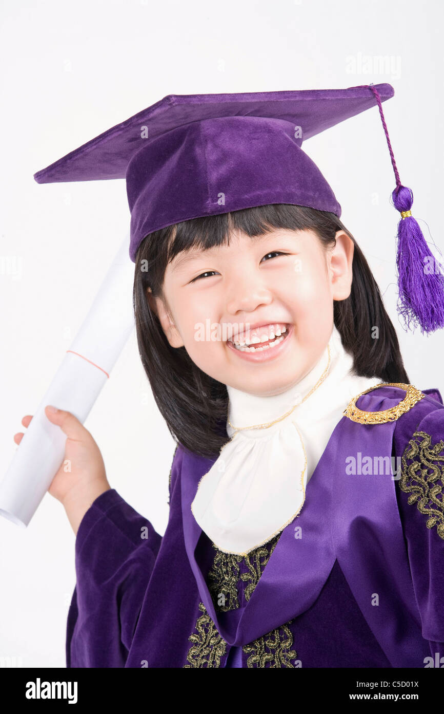 girl in graduation cap and gown Stock Photo - Alamy