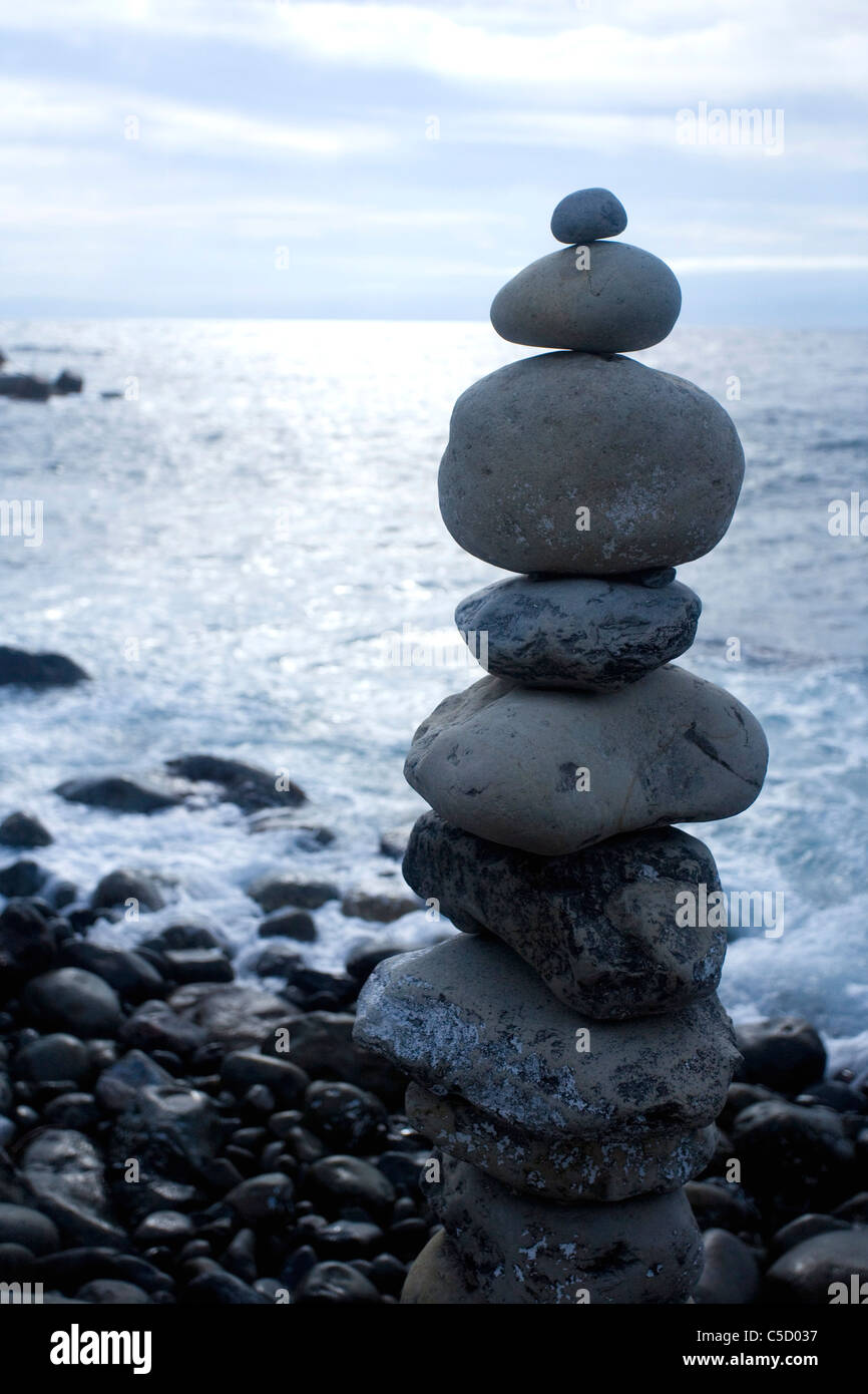 wishing stack of pebbles in seaside Stock Photo - Alamy