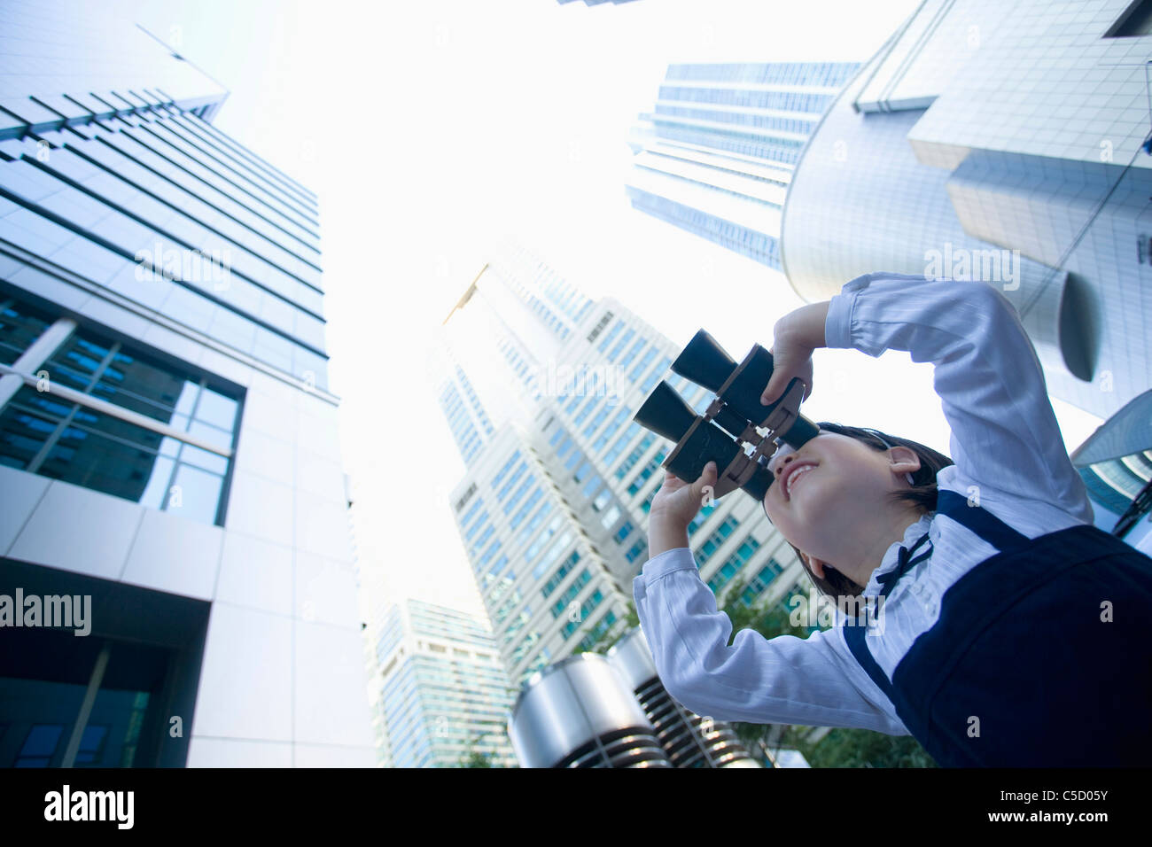 a girl see the scape through telescope Stock Photo - Alamy
