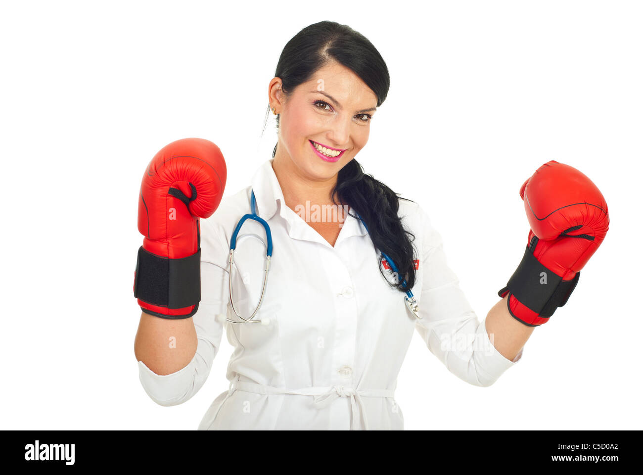 Successful doctor woman in white overall wearing boxing gloves isolated ...