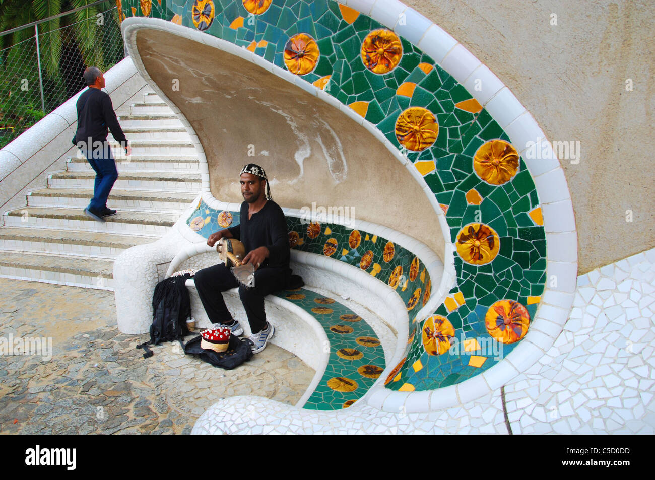 busker on bench near the famous lizard in Parc Guell Barcelona Spain ...