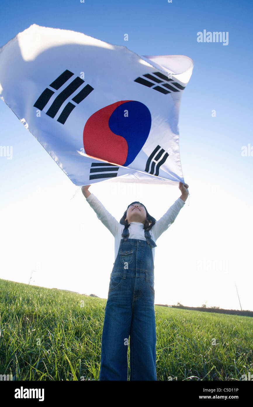 girl unfolding Nation flag of Korea Stock Photo - Alamy