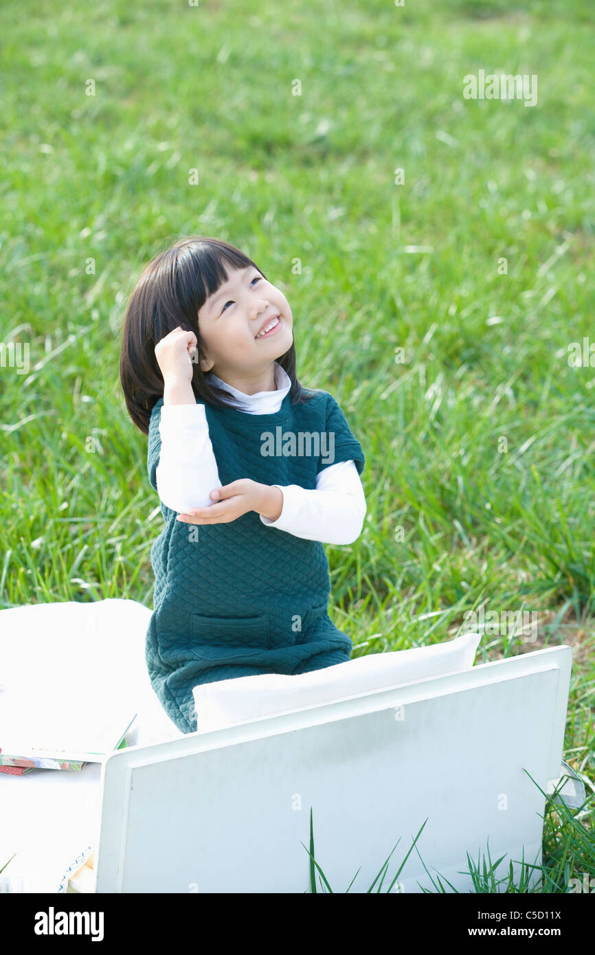 girl sitting on the field Stock Photo - Alamy