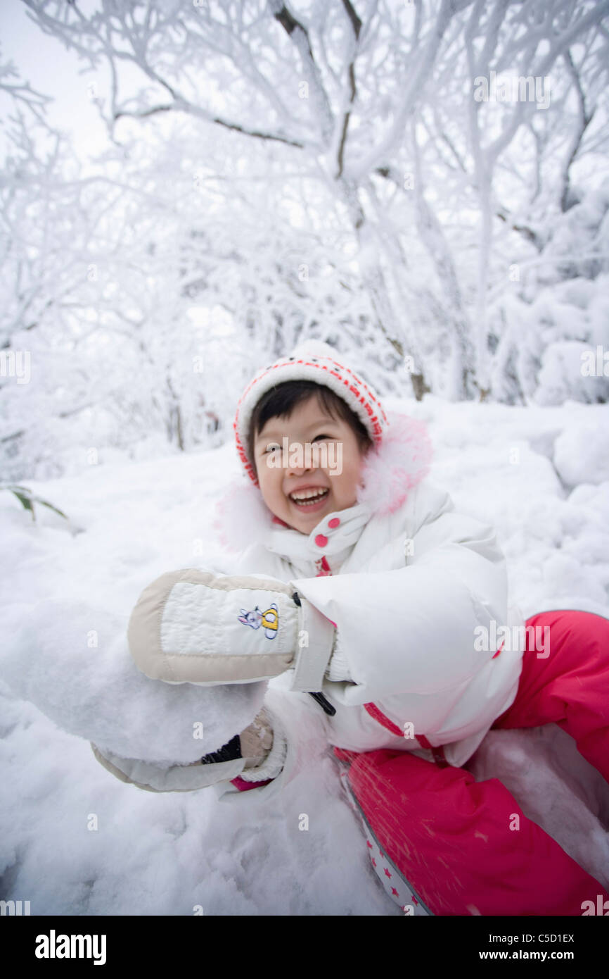 girl holding snowball Stock Photo - Alamy