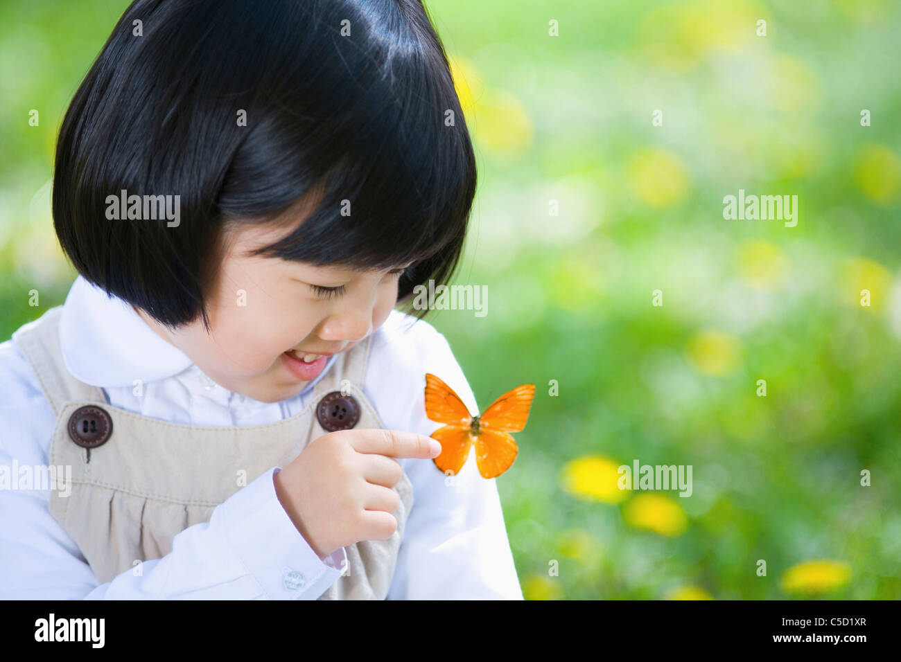 Girl touch butterfly sitting on hi-res stock photography and images - Alamy