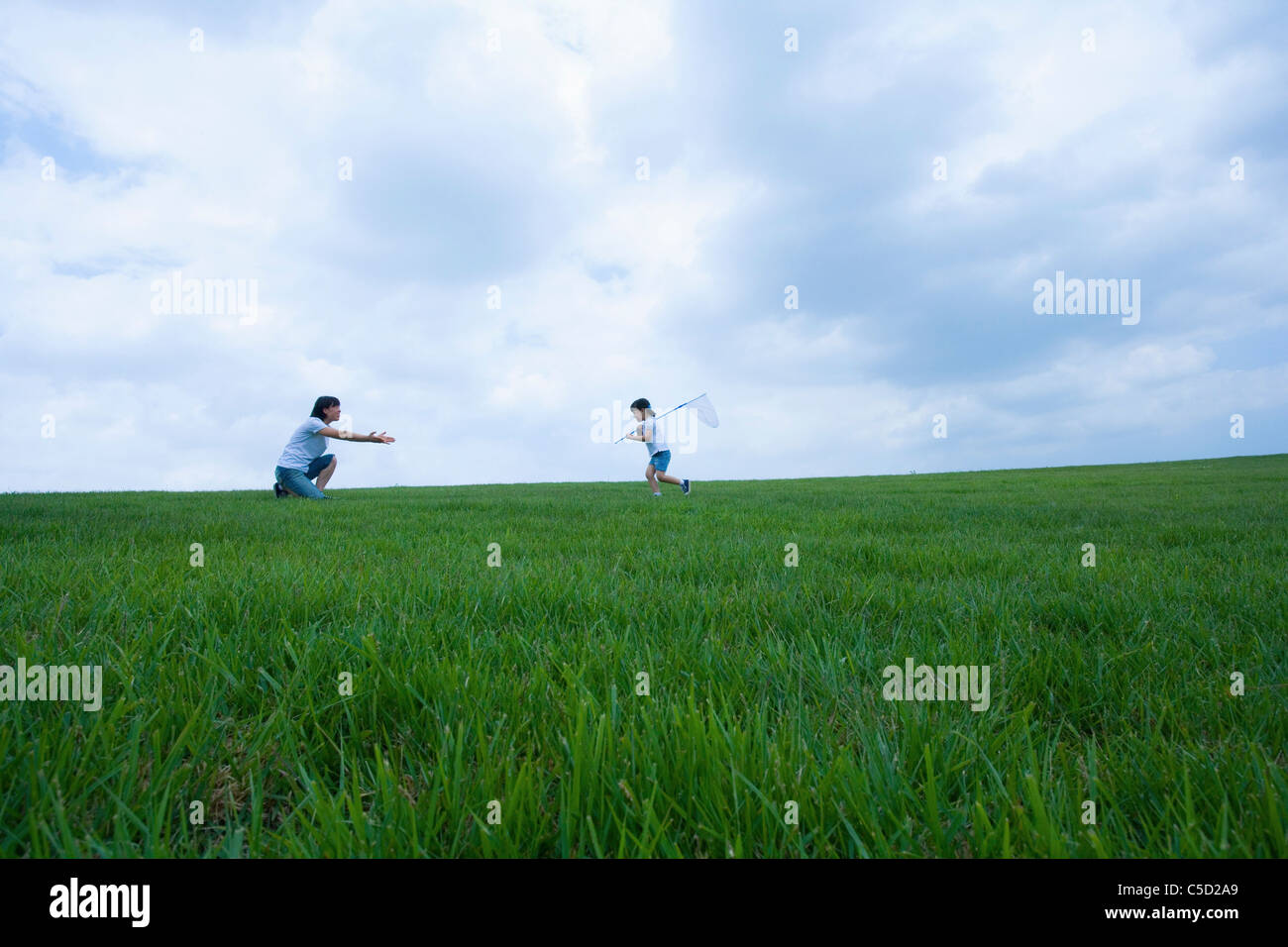 girl running to her mom Stock Photo - Alamy