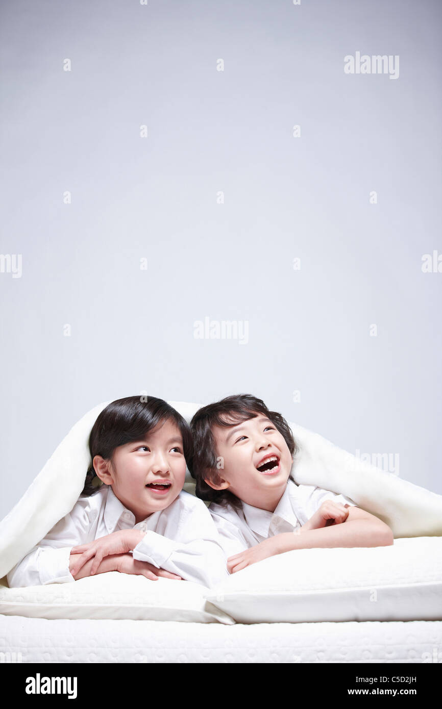 children education lay face down under the blanket Stock Photo - Alamy