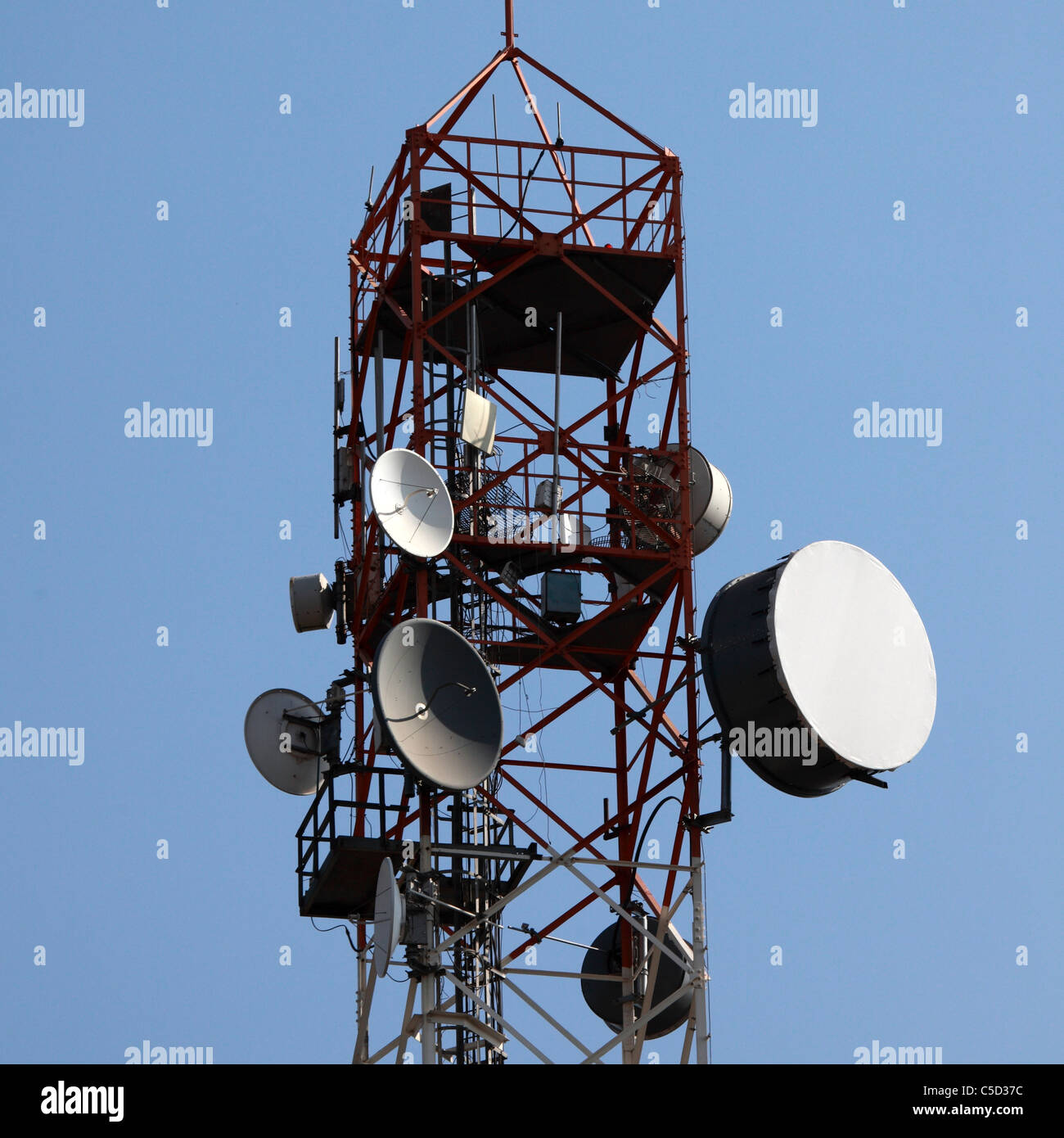 Satellite and radio communication devices on a communications mast ...