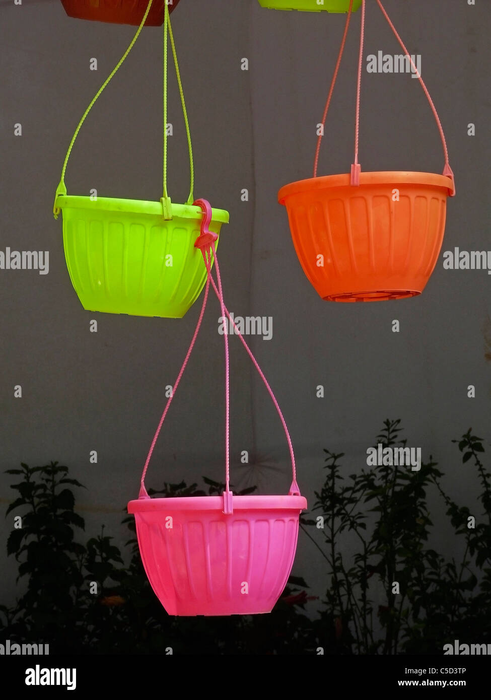 Plastic made colorful hanging plant pots Stock Photo - Alamy