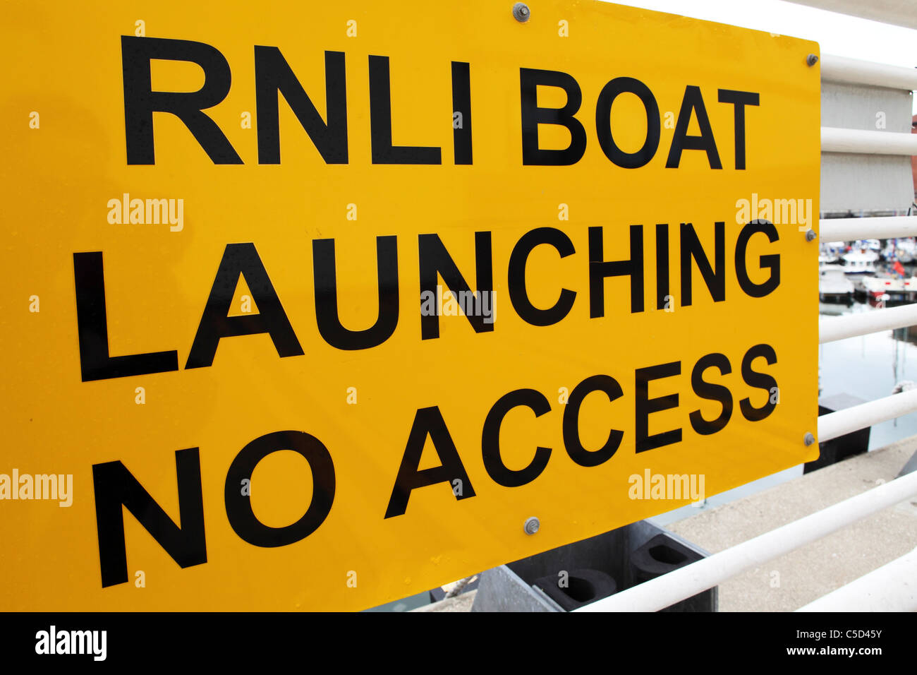 A sign warns that RNLI lifeboats can be launched at this site Stock ...