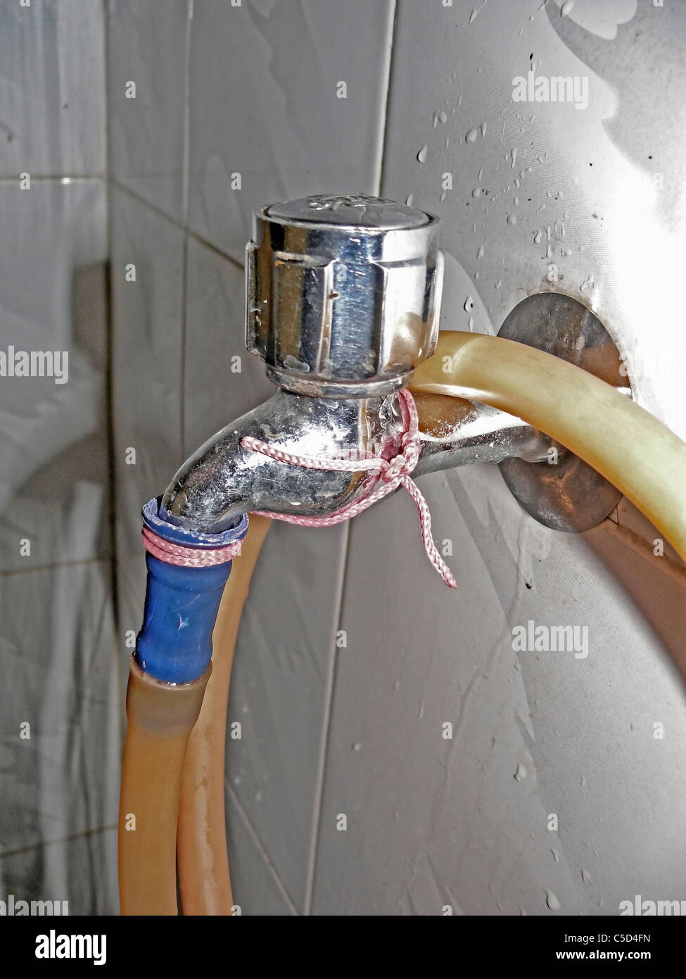 Water pipe with rubber pipe Stock Photo - Alamy