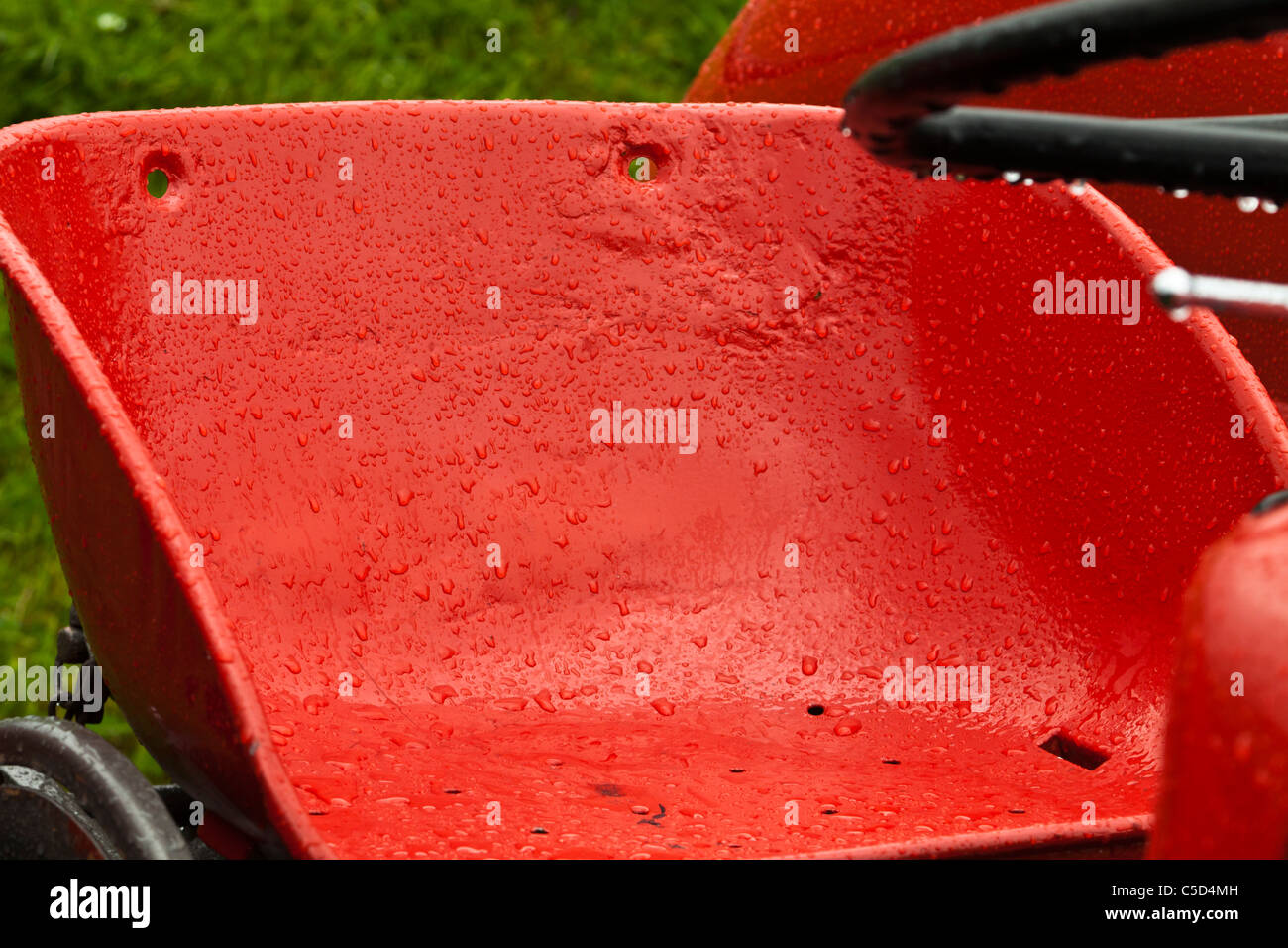 Tractor seat in the rain Stock Photo - Alamy