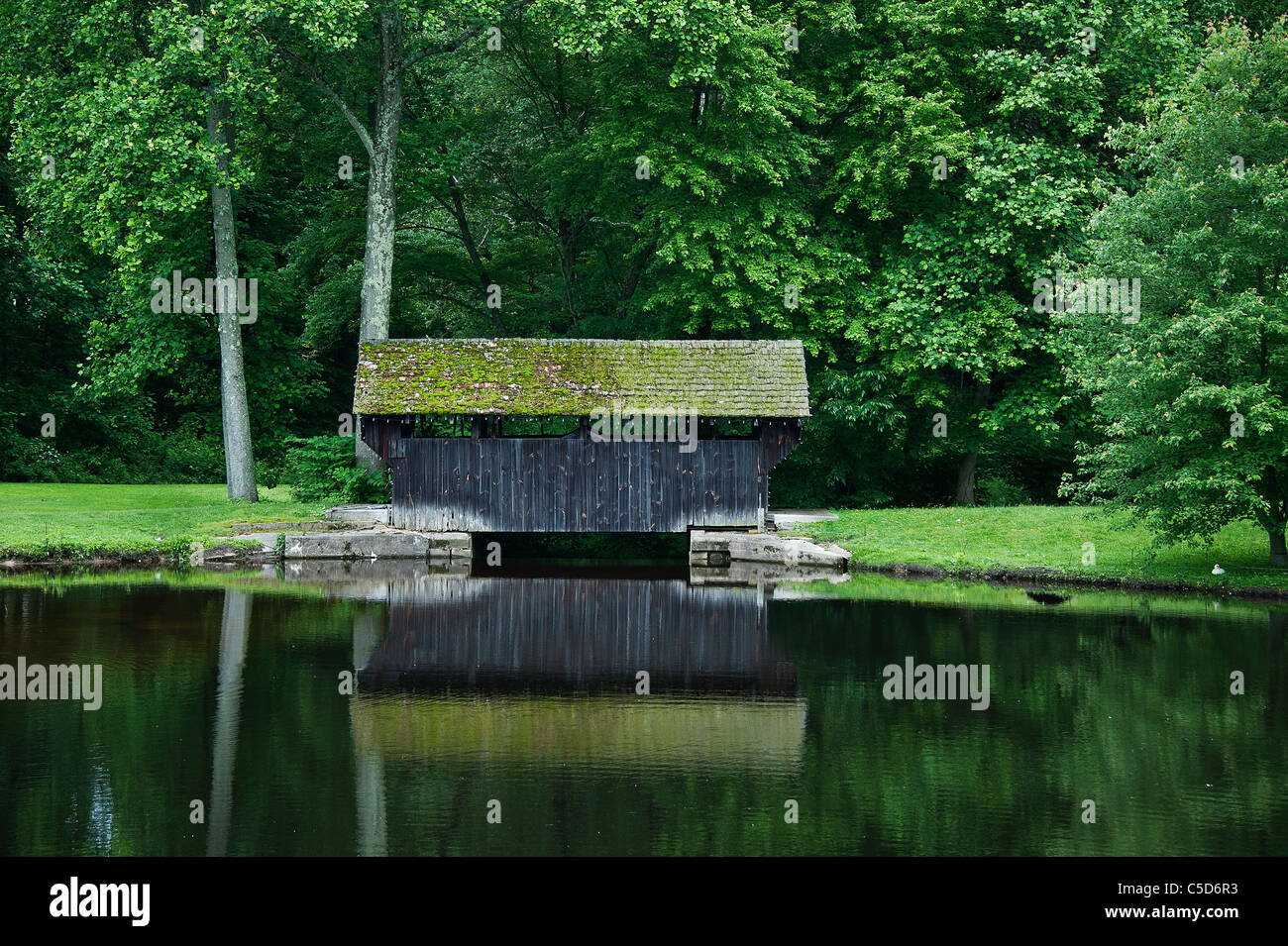 Covered bridge in a park Stock Photo - Alamy