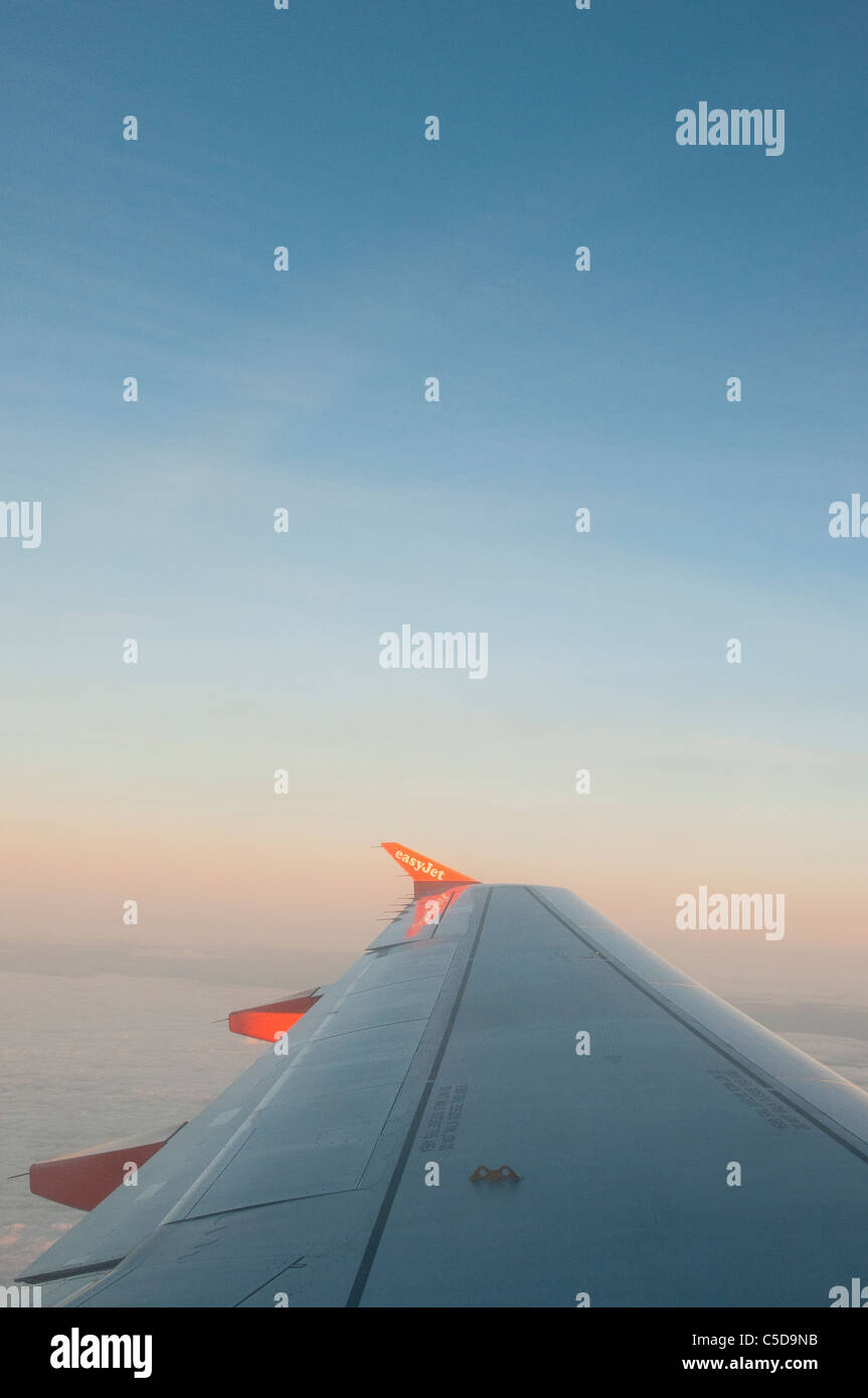 View through an Easyjet aircraft window flying above clouds Stock Photo ...