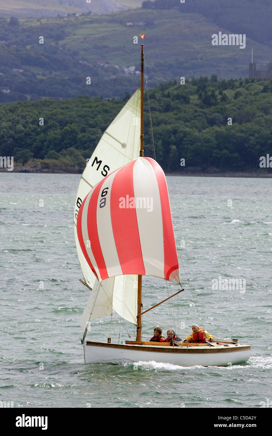 A sailing dinghy on the Menai Straits off Beaumaris on the Isle of ...