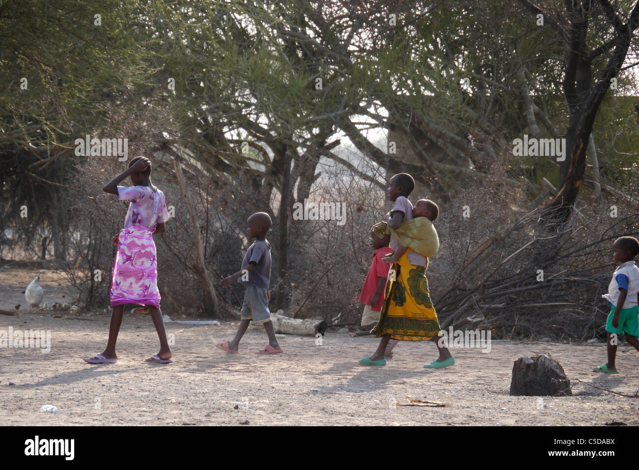 TANZANIA Village of Mwamalasa, Shinyanga. Children walking, some ...