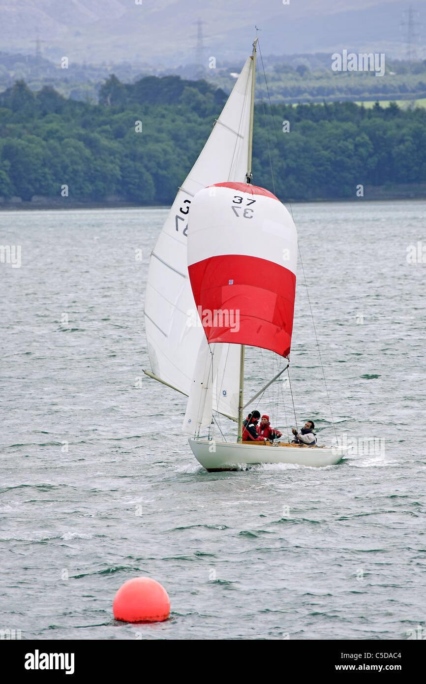 A sailing dinghy on the Menai Straits off Beaumaris on Anglesey, North ...