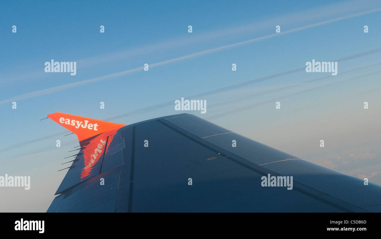 View through an Easyjet aircraft window flying above clouds Stock Photo ...