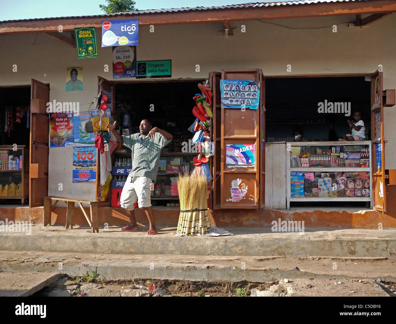 TANZANIA Street scenes in Mabatini, Mwanza. Small shops selling ...