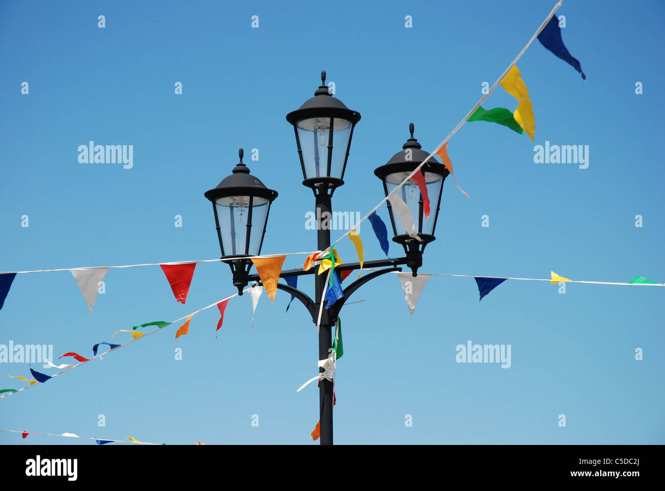 Lamp post and flags Stock Photo - Alamy