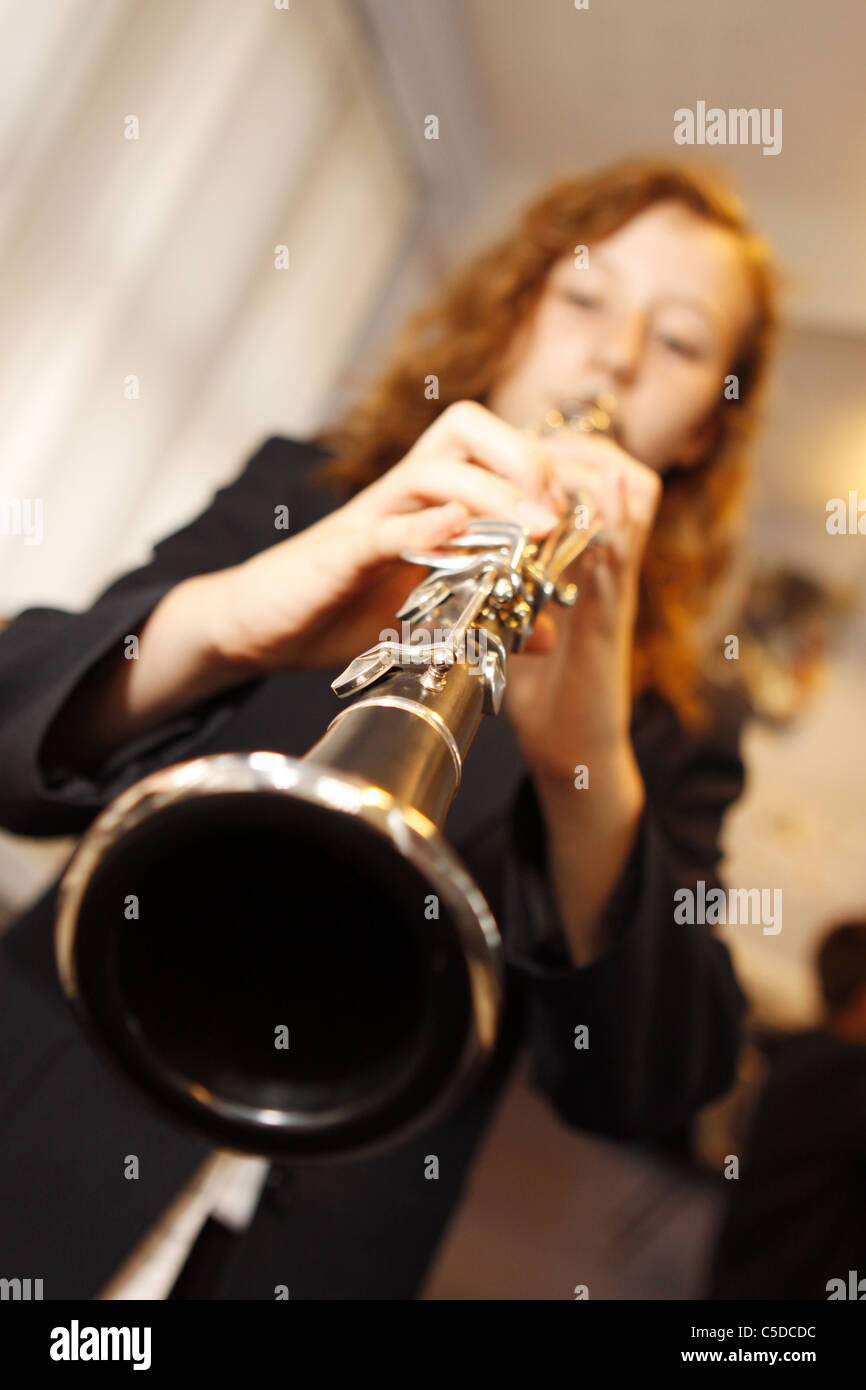 School music lesson secondary school girl pupil playing the clarinet ...