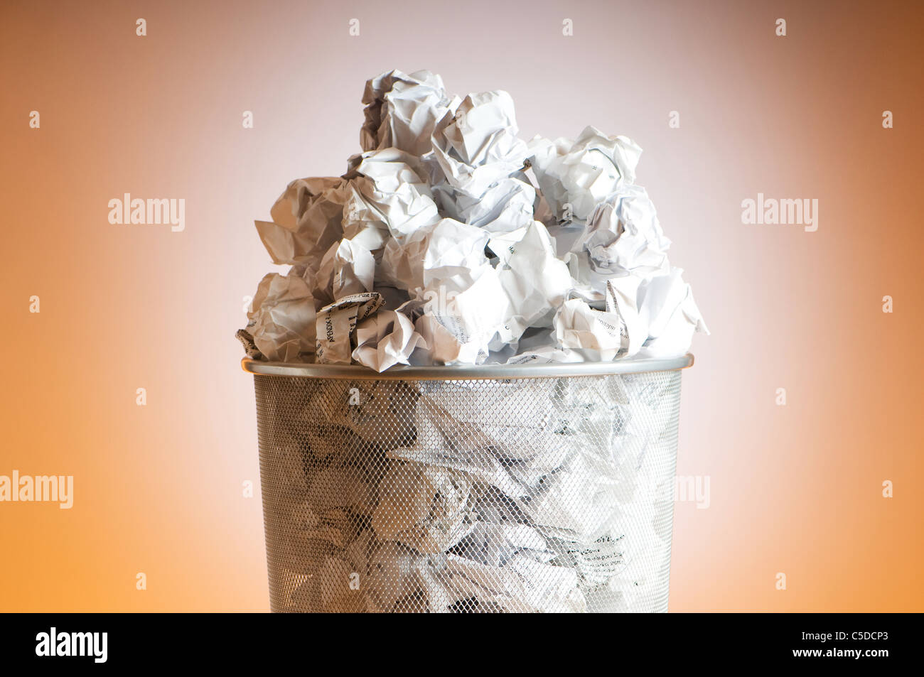 Garbage bin with paper waste isolated on white Stock Photo - Alamy