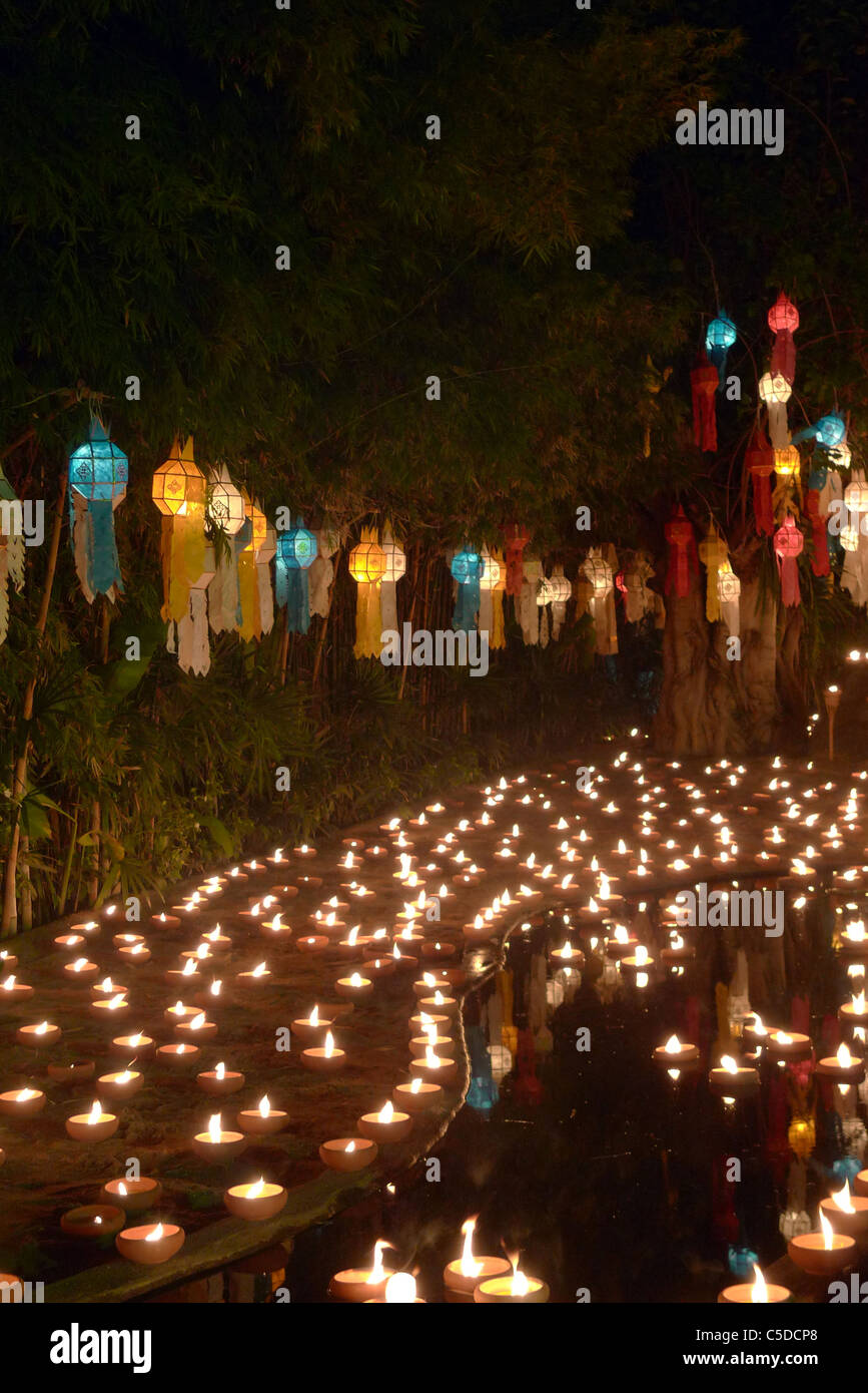 THAILAND Chiang Mai. Loi Krathong lantern Festival. Candle lit shrine ...